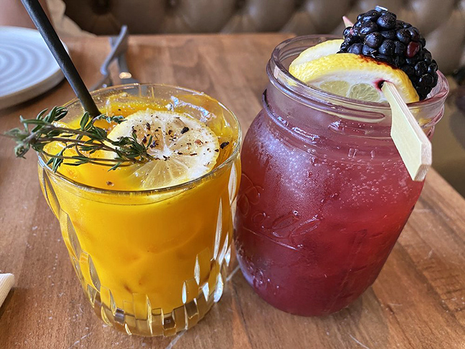 Cocktail chemistry at its finest – one sunshine-bright with herbs, one berry-rich and bourbon-forward. Liquid Southern hospitality in glassware.