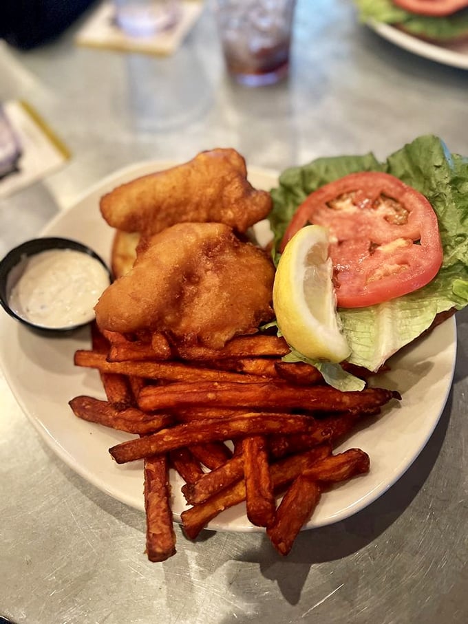 The walleye sandwich doesn't just represent a meal; it's Great Lakes cuisine in handheld form &ndash; crispy, flaky, and demanding to be paired with those seasoned fries.