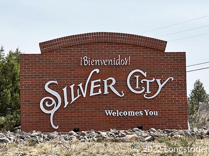 "¡Bienvenidos!" declares this welcoming sign, a bilingual greeting that perfectly captures Silver City's cultural blend, standing sentinel at the town's entrance.