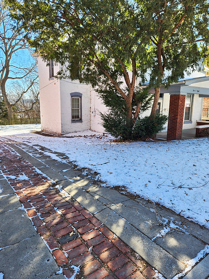 Winter transforms the Sallie House into a scene from a gothic novel. The snow-covered walkway invites the brave while warning the wise.