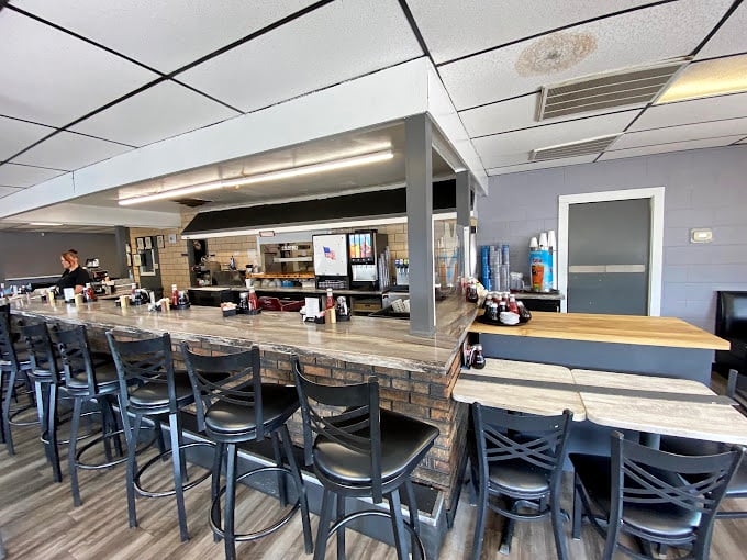 The counter seating&mdash;where solo diners become regulars and the staff eventually knows your order before you sit down.