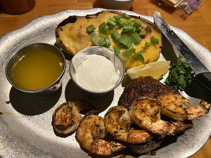 Land meets sea in perfect harmony&mdash;blackened steak and succulent grilled shrimp with a loaded potato that's dressed for a night out.