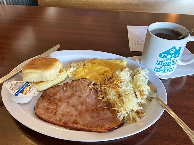 When breakfast meats get the respect they deserve: savory ham steak, cloud-like eggs, and hash browns that have clearly been introduced to proper seasoning.