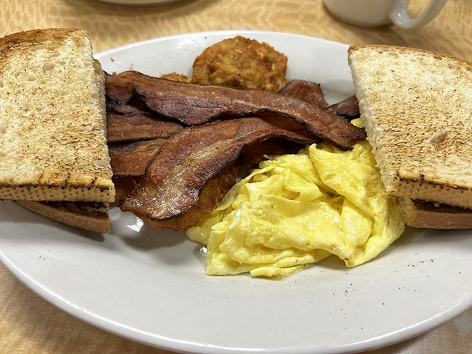 Hollandaise: the sunshine-colored sauce that makes everything better. These biscuits aren't just baked; they're engineered for maximum comfort delivery.