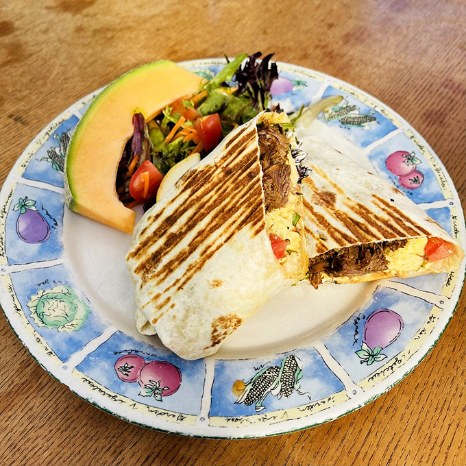 A wrap so perfectly grilled it deserves its own Instagram account, served with a slice of melon that's practically waving hello.