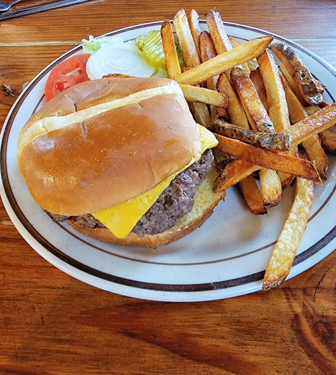 A cheeseburger that doesn't need gimmicks, just honest beef and hand-cut fries that make you question why you ever ate the frozen kind.