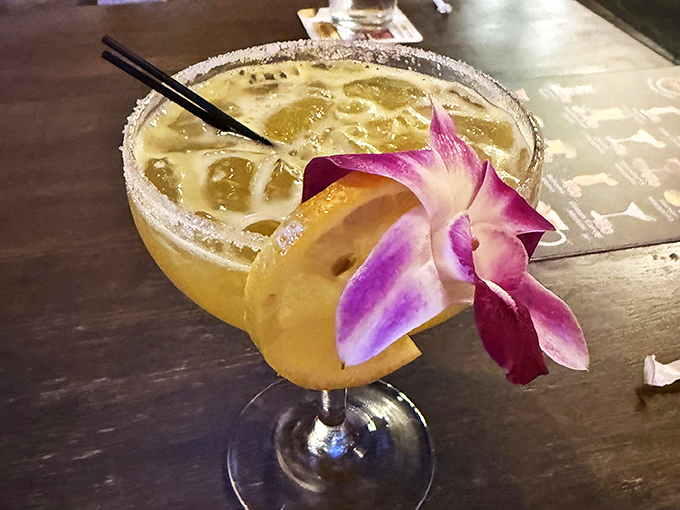 This isn't just a cocktail&mdash;it's a tropical vacation in a glass, complete with its own floral lei and sugar-rimmed passport.