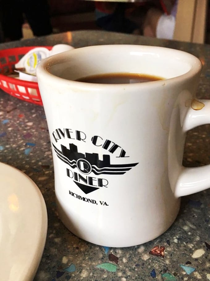 That iconic white mug with the River City logo&mdash;holding what might be the most honest cup of coffee in Virginia. No pretension, just caffeine.