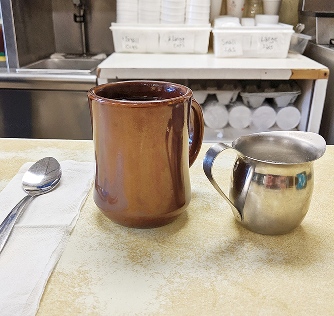The sturdy brown mug and silver creamer&mdash;companions to countless conversations and the perfect counterpoint to a chili dog feast. 