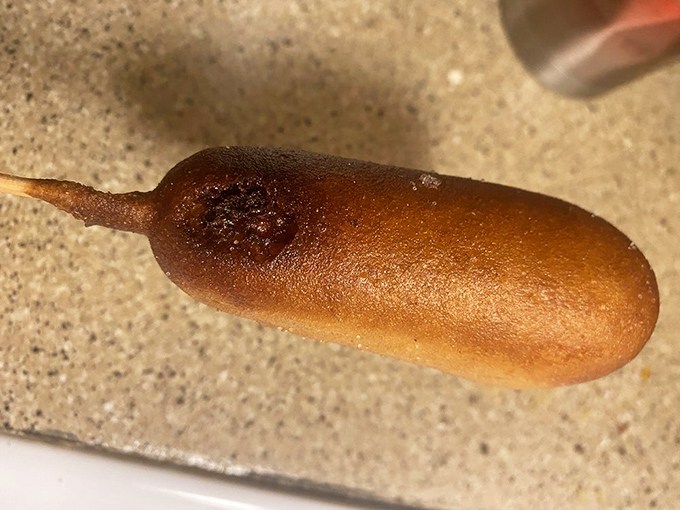 The humble corn dog&mdash;state fair nostalgia on a stick, available without having to navigate carnival crowds. Golden-fried perfection you can hold in one hand.