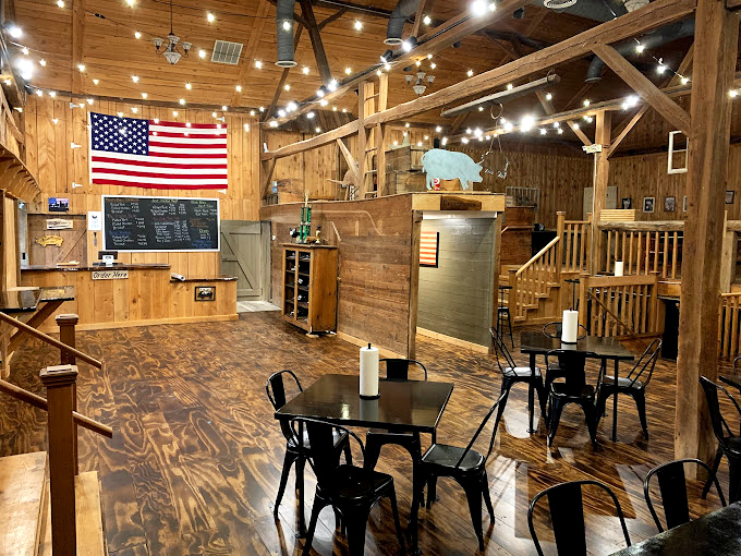 The rustic charm of Big Dan's interior feels like a BBQ cathedral &ndash; all wooden beams, American flags, and the promise of smoky salvation at every table. 