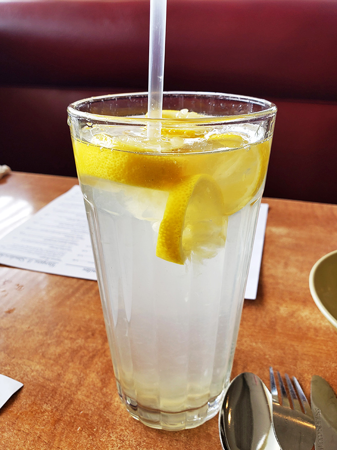 Sweet tea so perfectly balanced it could broker peace treaties—served ice-cold with a lemon wedge that means business.
