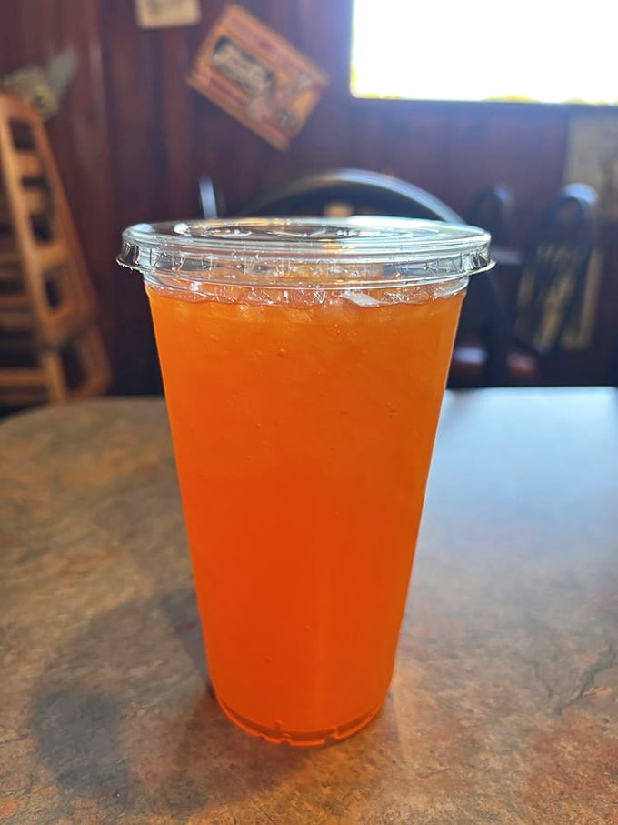 That vibrant orange drink isn't just refreshing—it's nostalgia in liquid form, taking you back to summer afternoons when life was simpler.