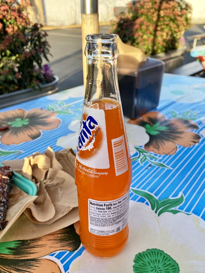 Nothing complements barbecue quite like an ice-cold orange soda against a backdrop of vintage-inspired tablecloths. 