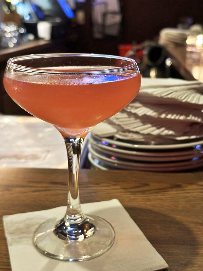 This blush-colored cocktail isn't just a drink, it's liquid hospitality in a perfectly chilled coupe glass.