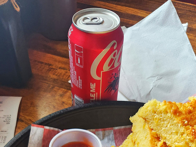 Even the beverages keep it real&mdash;a classic Coca-Cola in a can, because some things don't need fancy glassware to hit the spot.