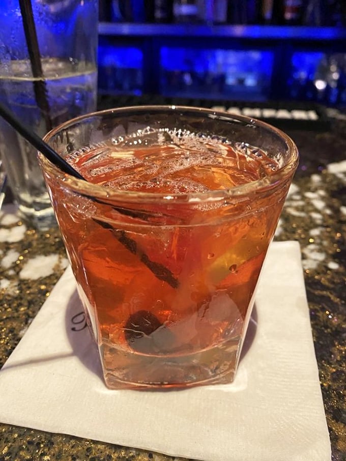 This isn't just a cocktail—it's liquid history in a glass, served with enough ice to sink a much smaller Titanic.