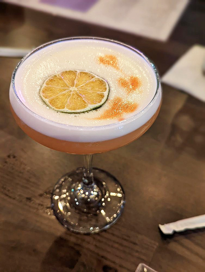 A cocktail that dresses better than most people at brunch. That floating lime wheel is basically jewelry for your drink.
