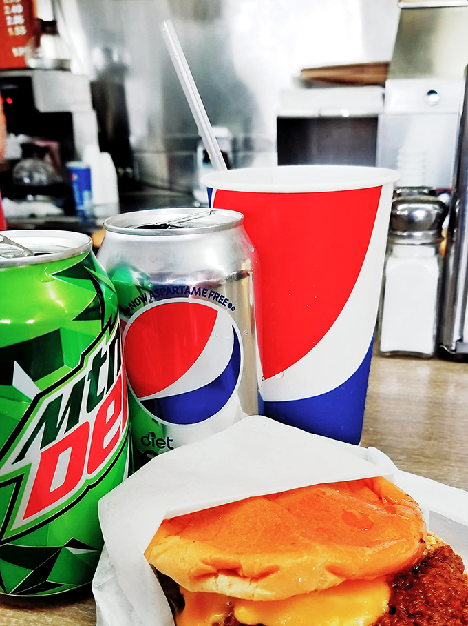 The classic American trio: burger, soda, comfort. Some traditions don't need reinvention&mdash;they just need to be savored one bite at a time.