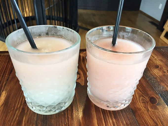 Two frosty glasses promising sweet relief from spicy adventures. Like firefighters in liquid form, they're here to save your burning taste buds.