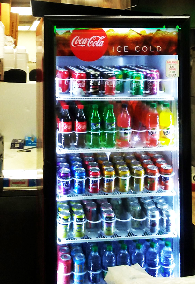 The drink cooler stands ready with an army of sodas and beverages, because battling chicken this good requires proper hydration.
