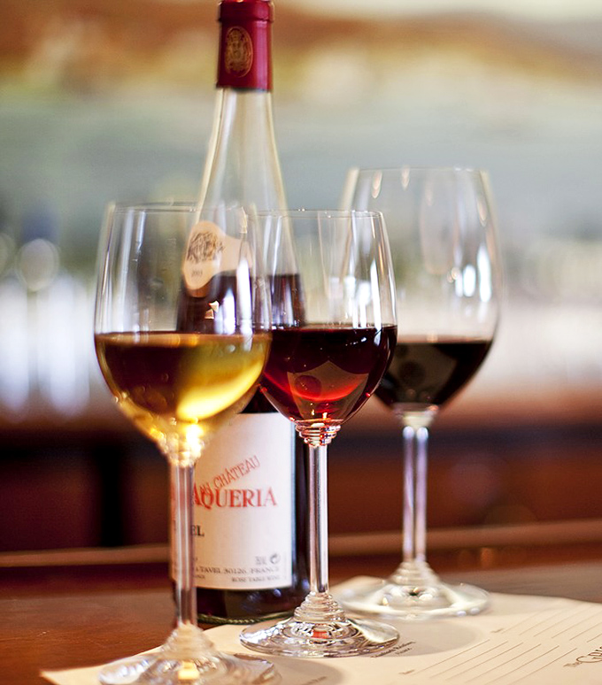 Wine glasses catching afternoon light like liquid prisms. The perfect companions for seafood stories and historic surroundings at Connecticut's maritime masterpiece.