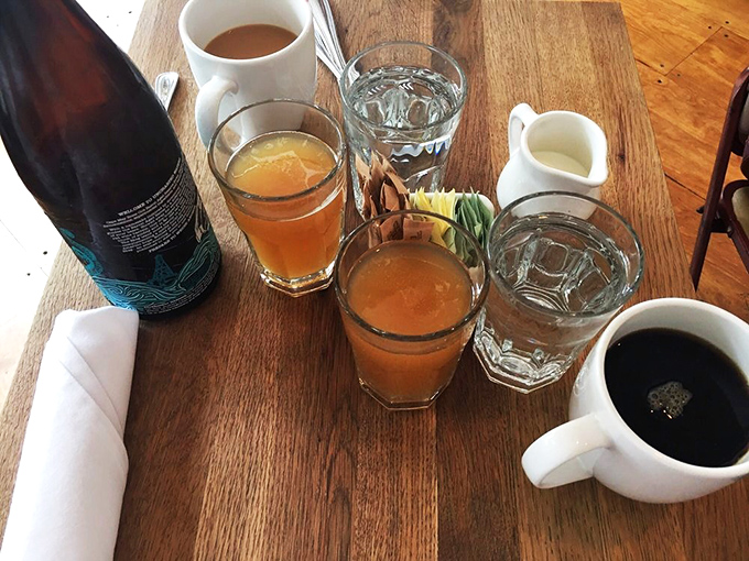 Morning libations lined up like old friends at a reunion. Coffee for survival, juice for virtue, and is that a mimosa for celebrating Tuesday? 