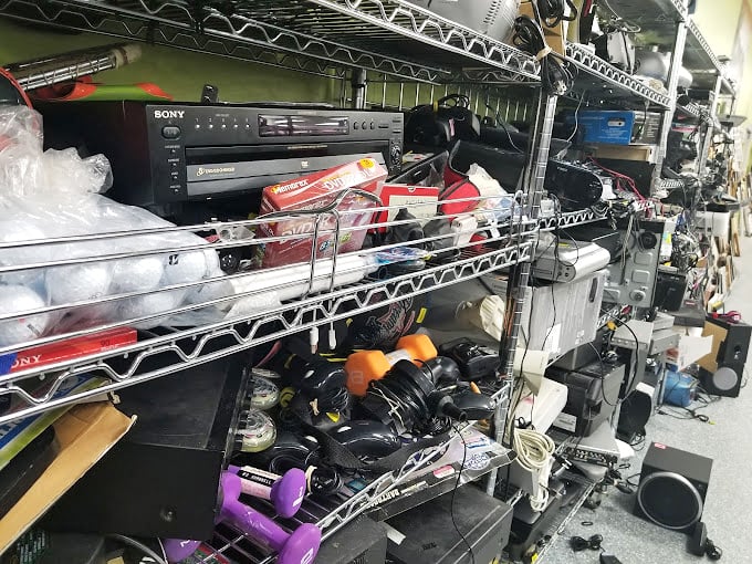 The electronics graveyard, where yesterday's must-have gadgets await resurrection. That Sony stereo system might just be your next conversation piece.