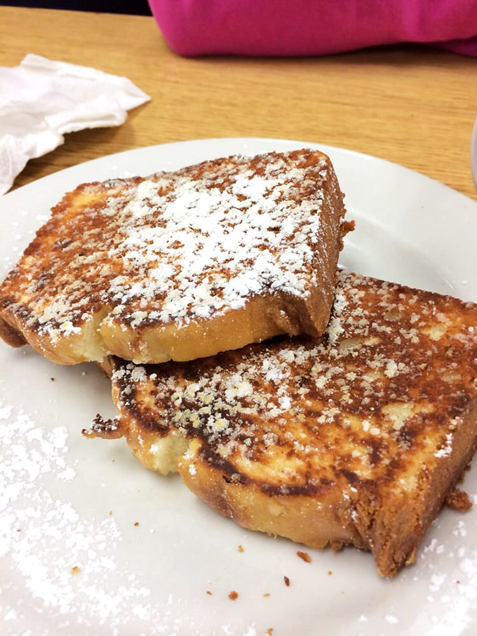 French toast that's achieved that magical caramelized exterior while maintaining a custardy soul&mdash;dusted with powdered sugar like a winter morning.