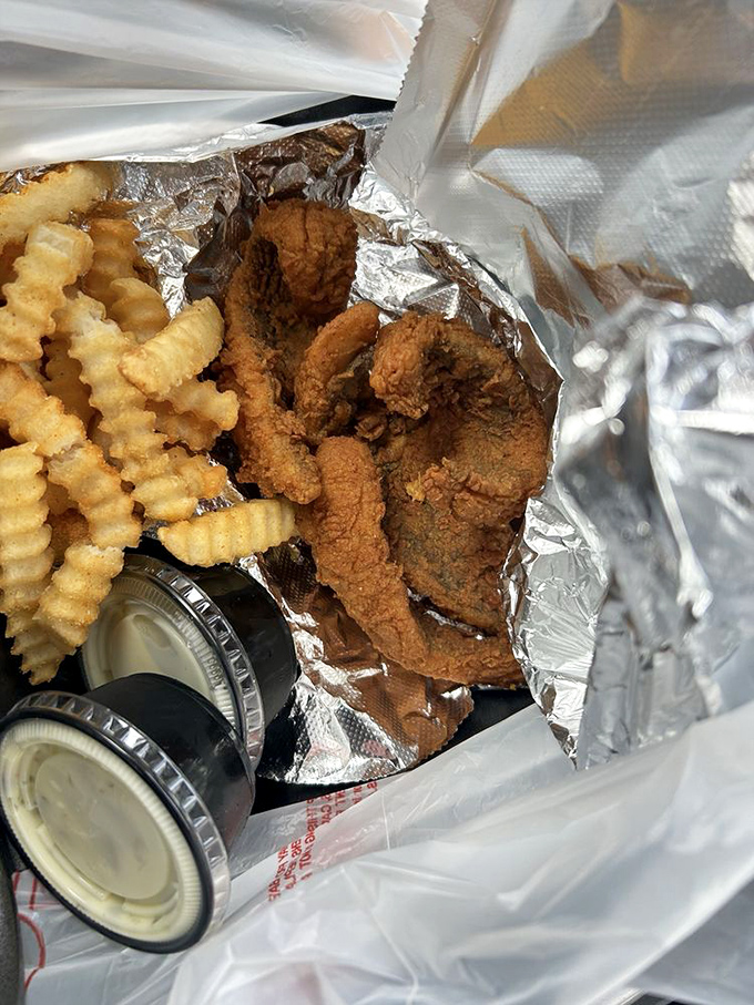 Fried fish and fries with dipping sauces&mdash;simple pleasures executed with the precision of a culinary symphony.