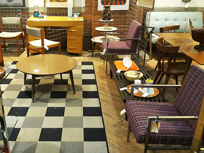 Mid-century modern meets Art Deco meets "that chair my grandparents had"&mdash;all on a checkerboard floor that screams vintage cool.