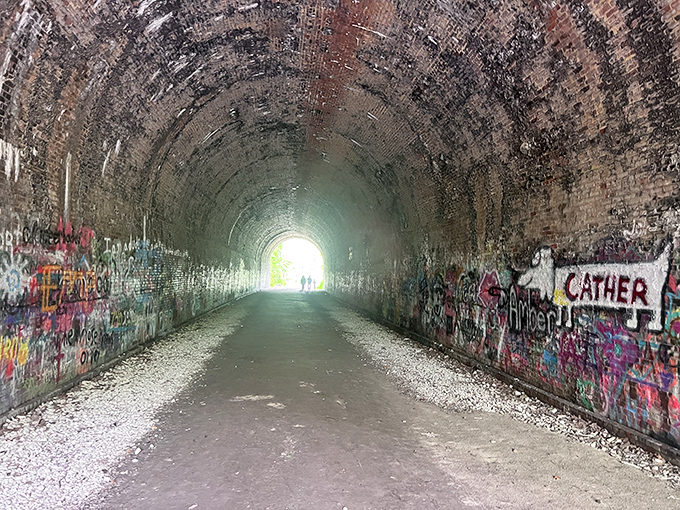 Street art meets ghost story inside the tunnel's belly. The rainbow of colors somehow makes the dark corners seem even more mysterious&mdash;like a haunted house decorated for a birthday party.