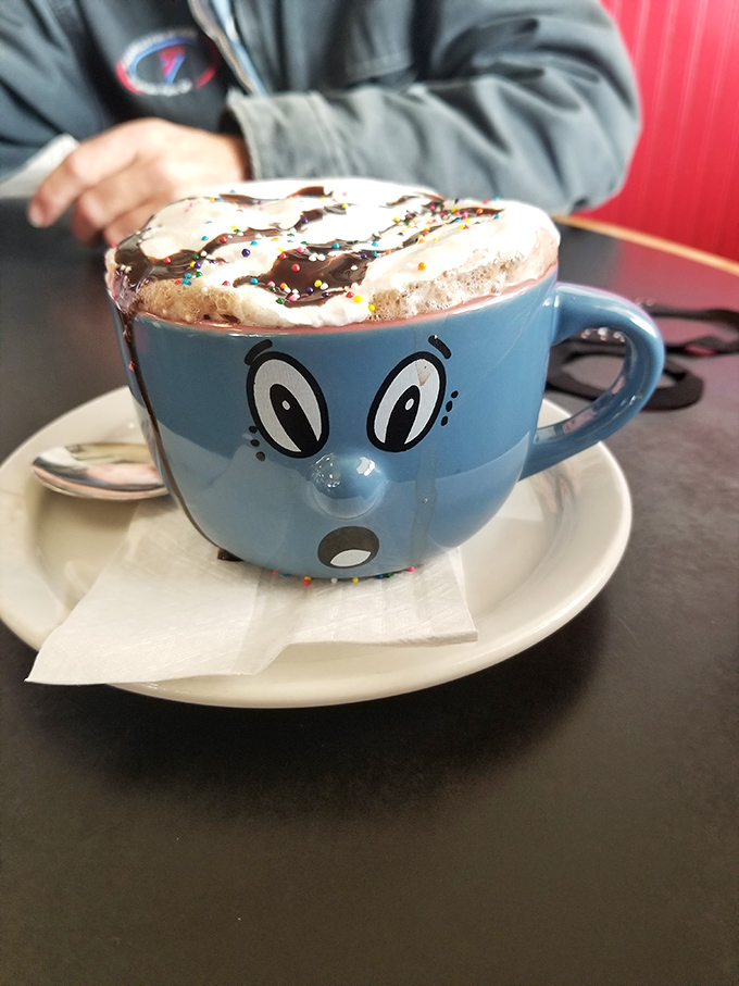 Hot chocolate served with a smile&mdash;literally. That mug's expression matches exactly how you'll feel after the first sip. 