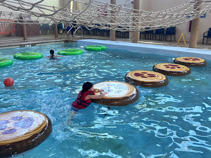 The kiddie area: where future Olympic swimmers take their first splashes and parents capture enough adorable photos to fill several digital albums. 