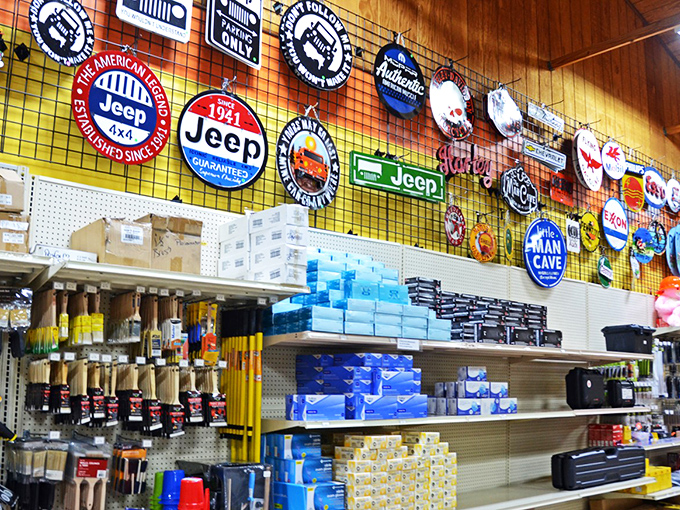Car enthusiasts will appreciate this wall of automotive nostalgia, where Jeep heritage proudly displays alongside practical tools below.