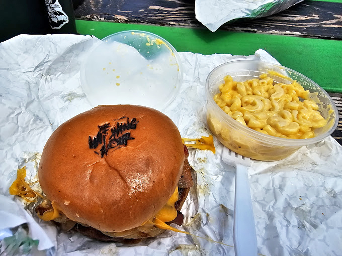 Mac and cheese that glows like radioactive comfort food &ndash; creamy, indulgent, and the perfect sidekick to a monstrous burger.