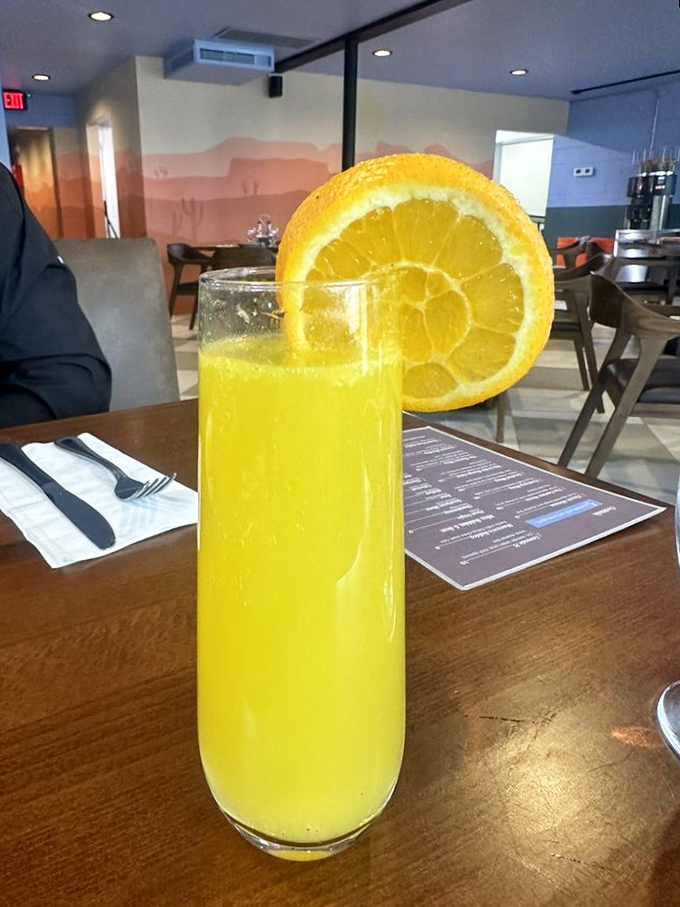 Fresh-squeezed orange juice that practically glows with vitamin C—nature's perfect companion to whatever breakfast indulgence you've chosen.