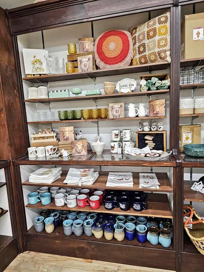 Handcrafted mugs and artisan pottery stand sentinel on wooden shelves like colorful ceramic soldiers waiting to be drafted into your morning coffee ritual.