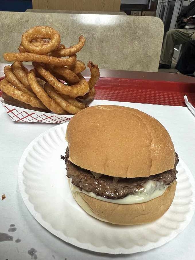 Those aren't just onion rings; they're golden halos of crispy perfection that make you forget whatever diet you swore to follow yesterday.