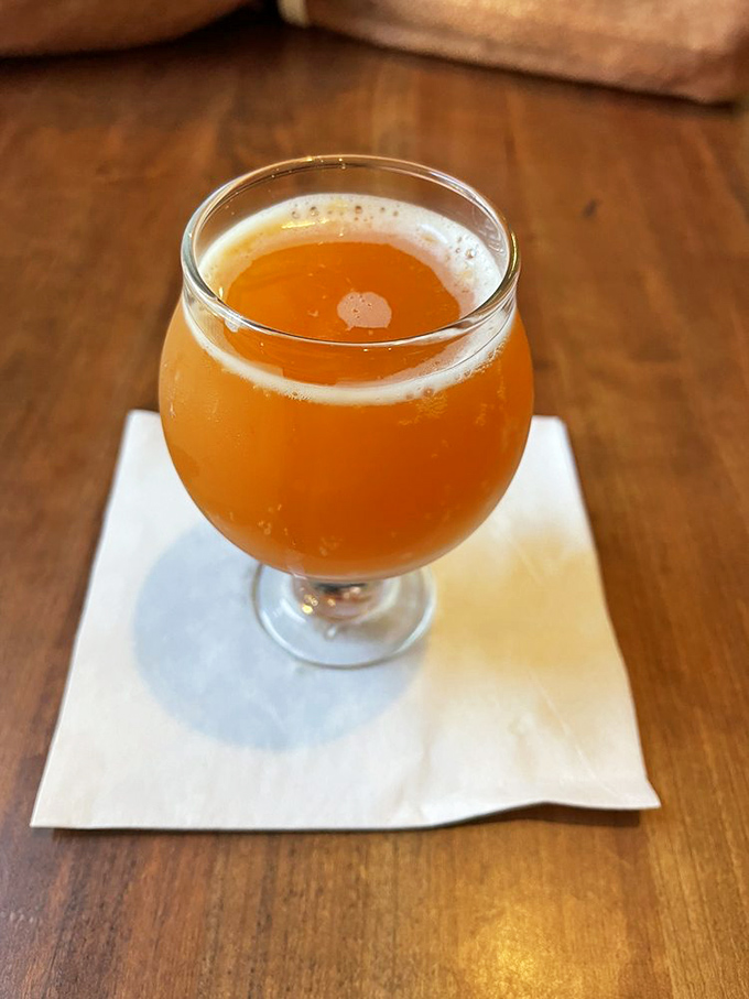 This golden craft beer isn't just a beverage—it's liquid sunshine in a glass, the perfect companion for washing down smoky delights.