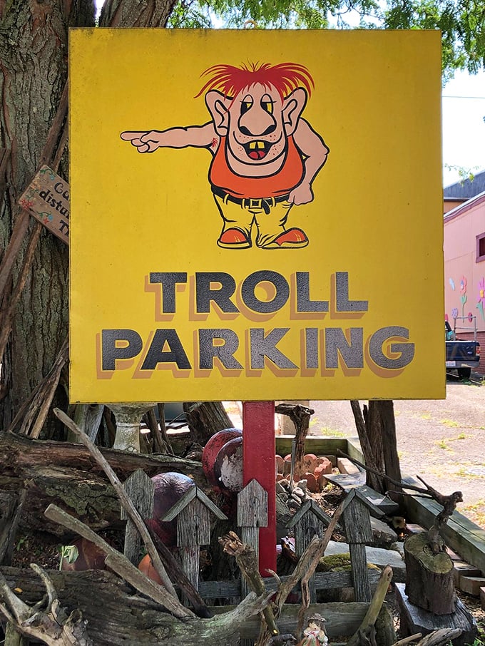 Even the parking signs embrace the quirky spirit of trolldom. This character, with his mischievous grin and pointing finger, sets the tone for the wonderfully weird adventure that awaits inside.
