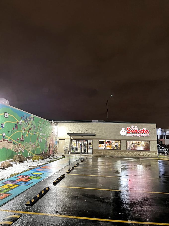 Even at night, Sweeties glows with sugary promise. That colorful mural hints at the adventure waiting inside those doors.