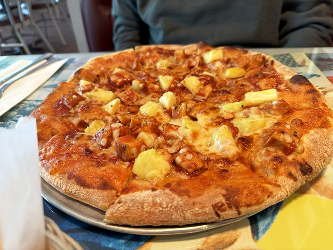 Pizza philosophers have long debated the perfect pineapple pie, but this golden-crusted beauty with its caramelized edges might just end the argument.