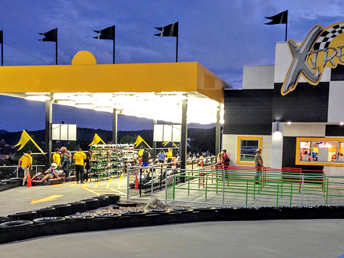 Evening racing under the lights adds dramatic flair to the Xtreme Racing experience. The checkered facade perfectly sets the motorsport mood.