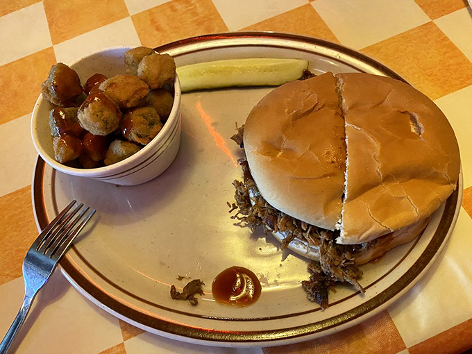 A pulled pork sandwich that doesn't need fancy frills to impress, just honest barbecue and a side of beans that didn't come from any can.