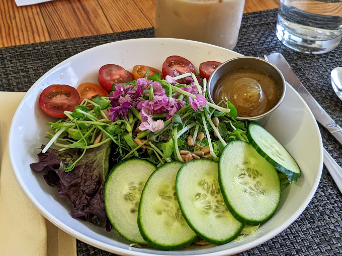 Fresh cucumber rounds and vibrant greens dance alongside ruby-red tomatoes. This salad doesn't apologize for being healthy&mdash;it celebrates it.