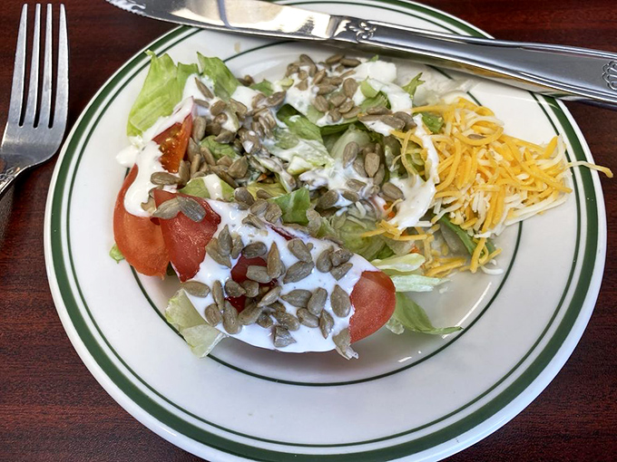 A salad that doesn't apologize for being healthy&mdash;crisp greens, ripe tomatoes, shredded cheese, and those sunflower seeds adding the perfect Kansas crunch.