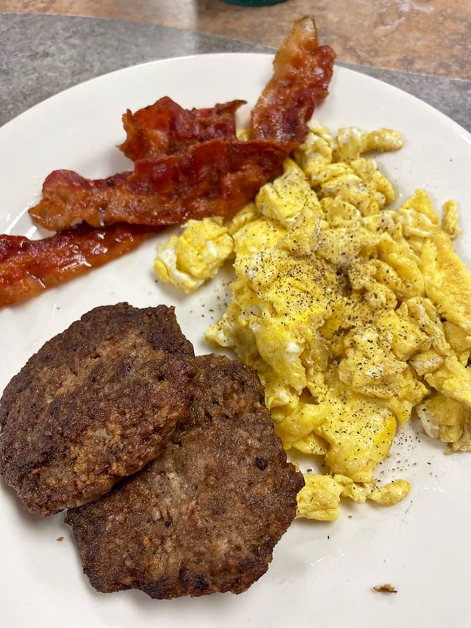 The holy trinity of breakfast: perfectly scrambled eggs, sausage with just the right snap, and home fries that could make a potato farmer weep. 