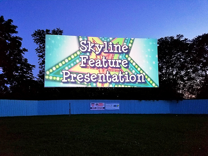 "Skyline Feature Presentation" glows against the darkening Indiana sky, that magical moment when day surrenders to cinema.