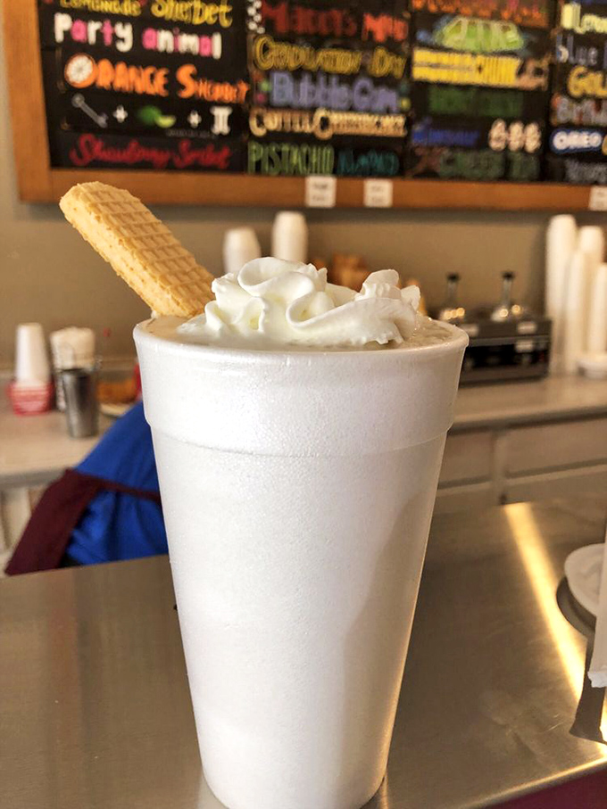 Not just a milkshake but a frothy celebration topped with whipped cream and a wafer cookie standing at attention.